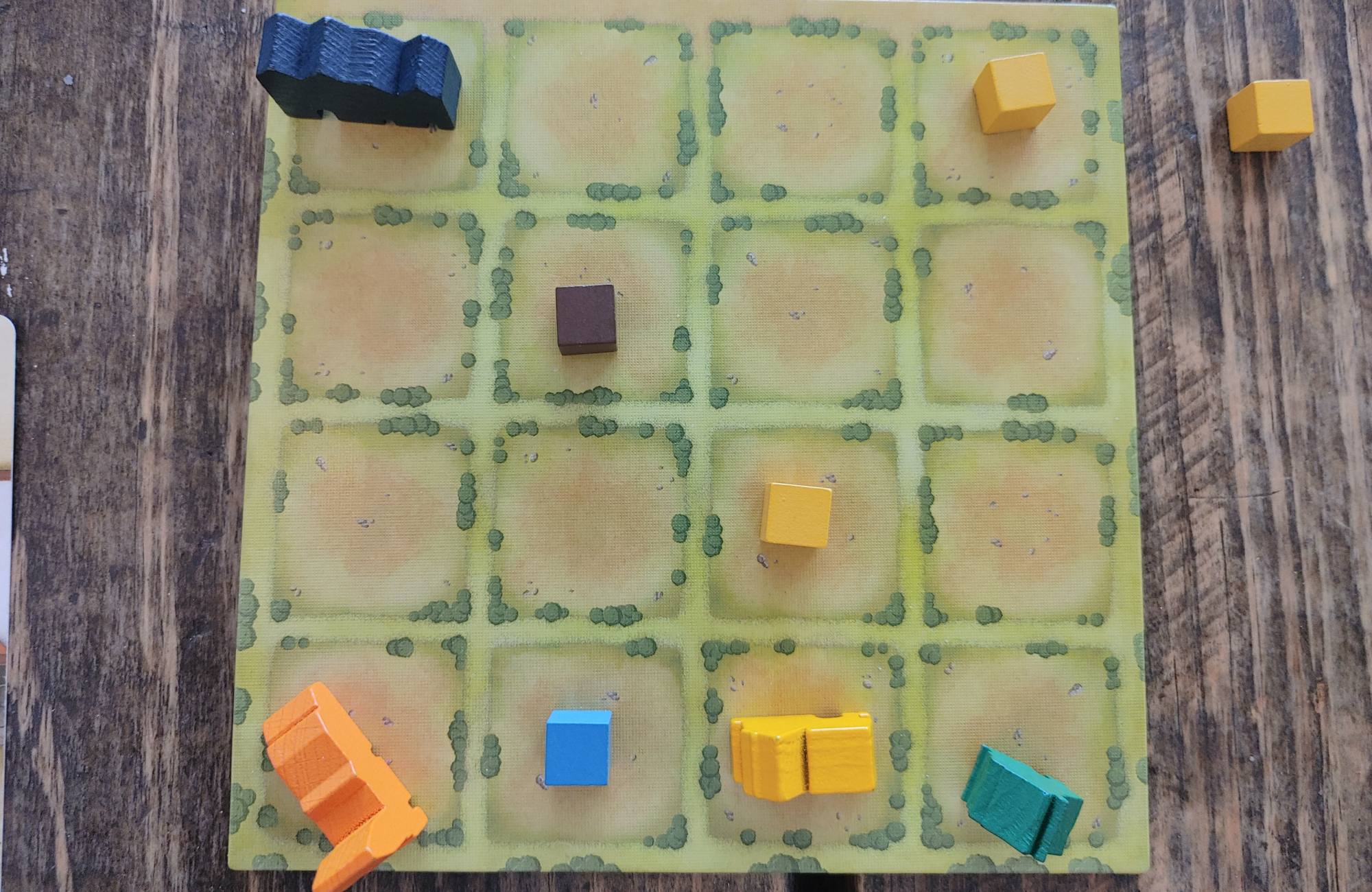 Tiny Towns - overhead view of a player board - One Board Family