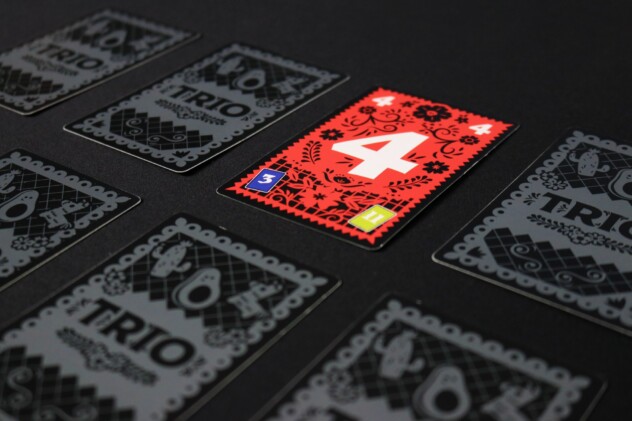 Trio cards on the table - One Board Family